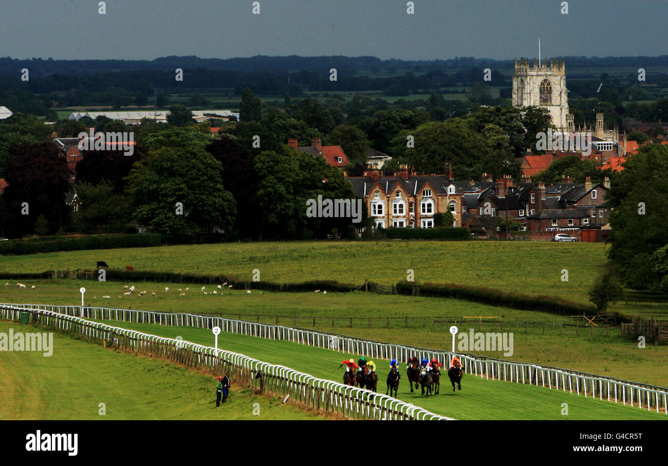 The field race up the hill towards the finishing post in The Racing UK ...