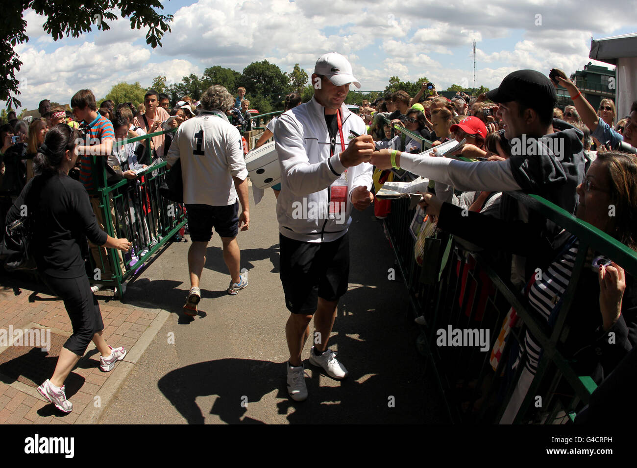 Andy Roddick signs autographs for fans on day four of the 2011 ...