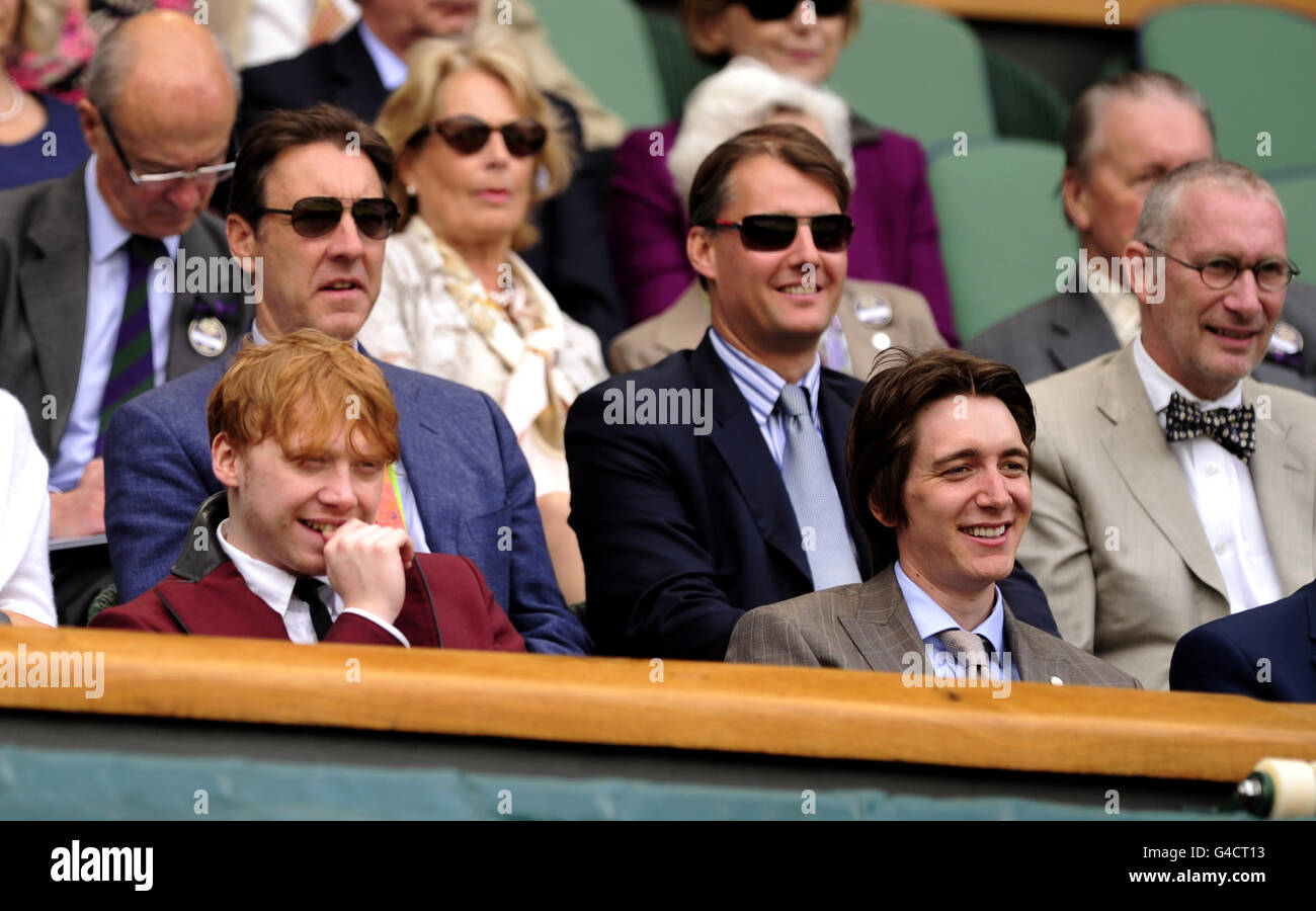 Actors Rupert Grint (left) and Oliver Phelps watch the match between ...