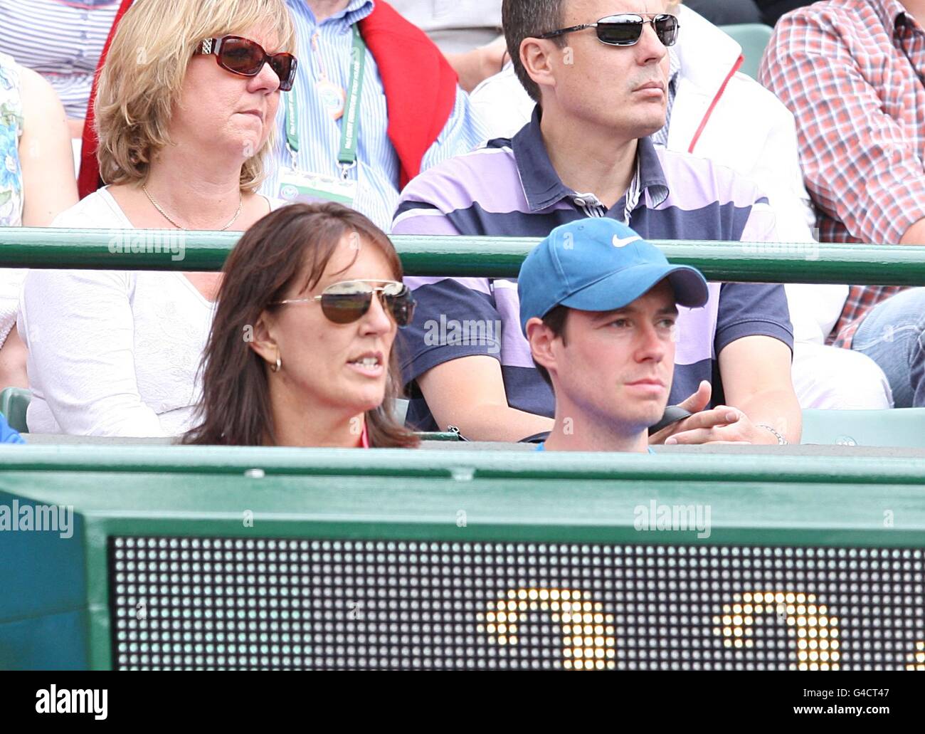 Laura Robson's mother Kathy Robson (left) watches in the stands on day ...