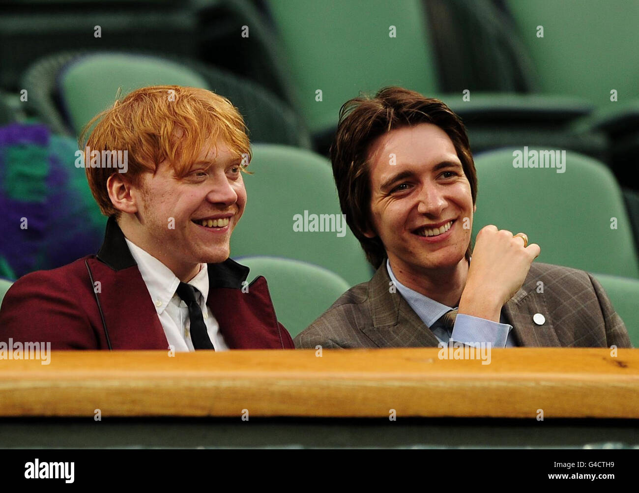 Rupert Grint (left) and Oliver Phelps sit in the Royal Box on Centre ...