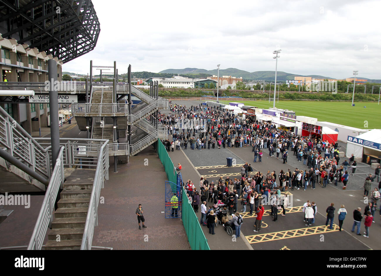 General view of the crowd queuing up to get into the stadium Stock ...