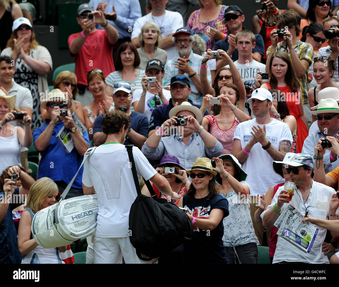 Fans take pictures of Great Britain's Andy Murray after he won his ...