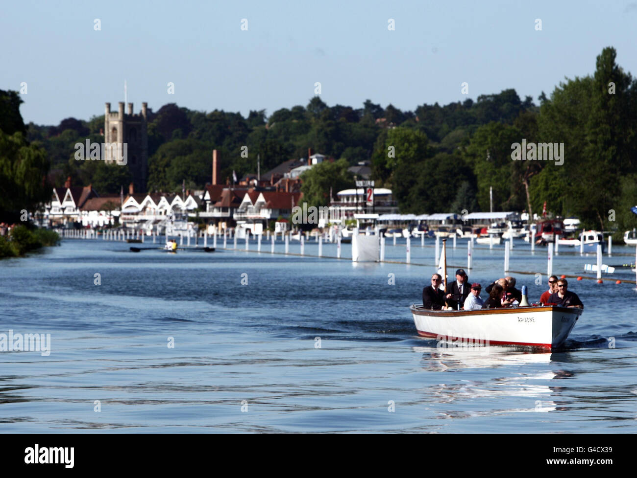An Umpires boat makes its way to the start during day one of the Henley ...
