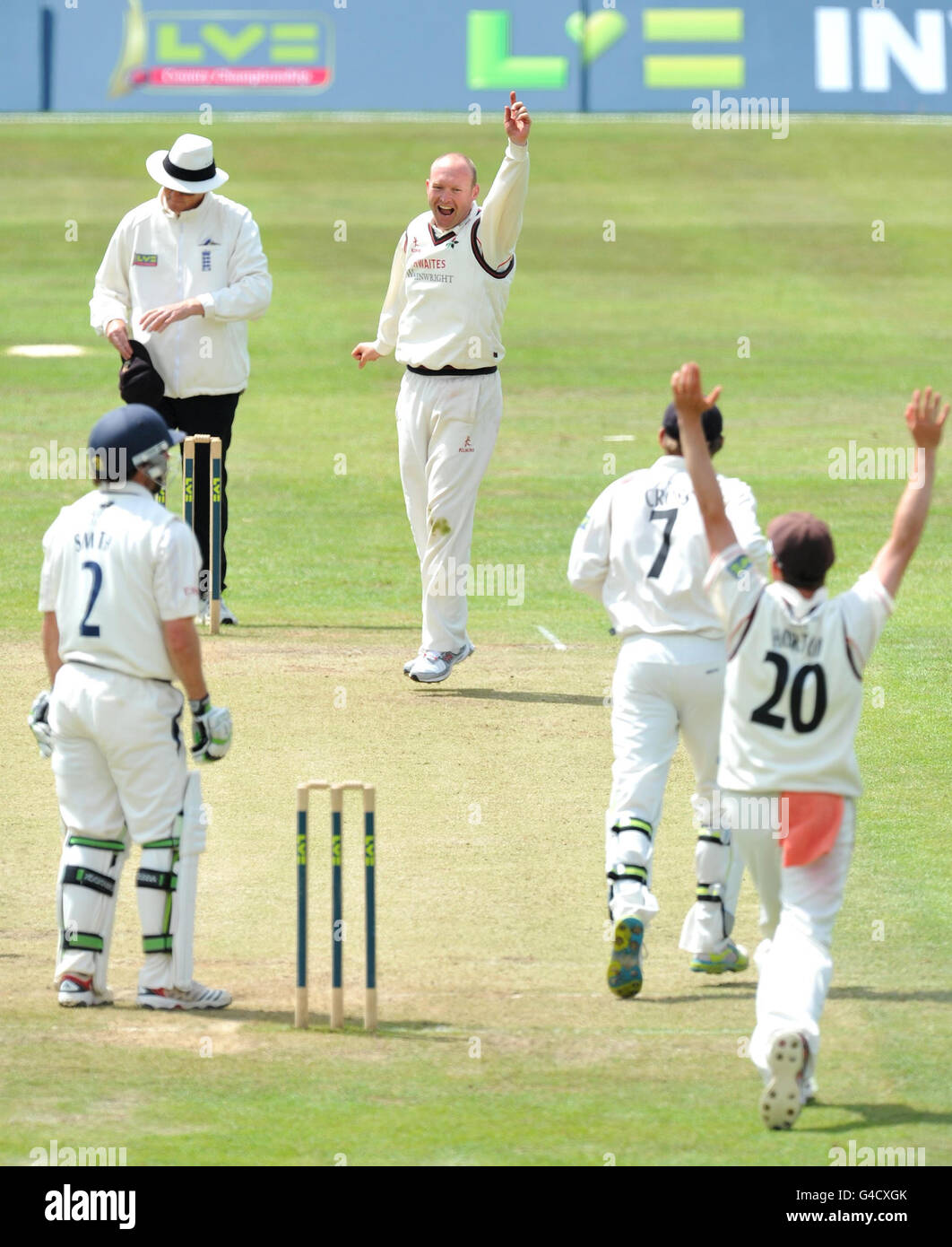Lancashire's Gary Keedy (centre) celebrates taking the wicket of Durham ...