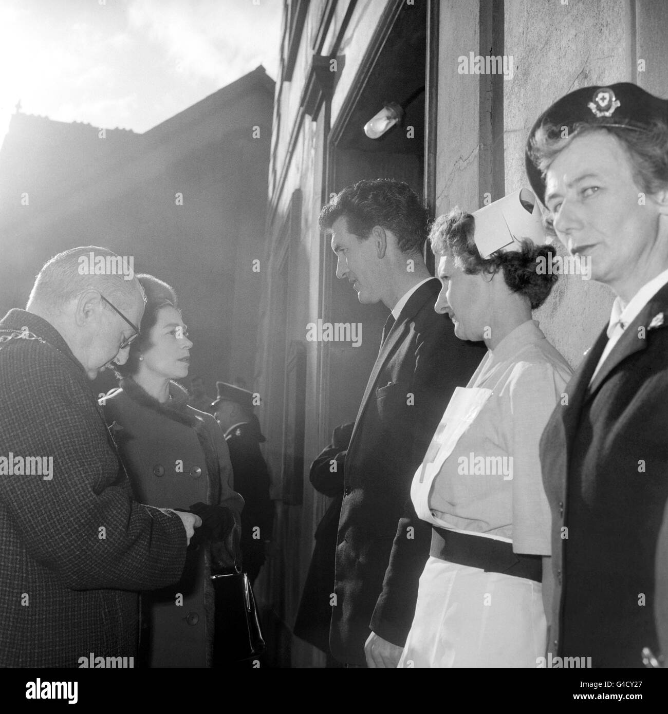 The Queen meets a Mr Regan who lost his daughter in the colliery spoil ...