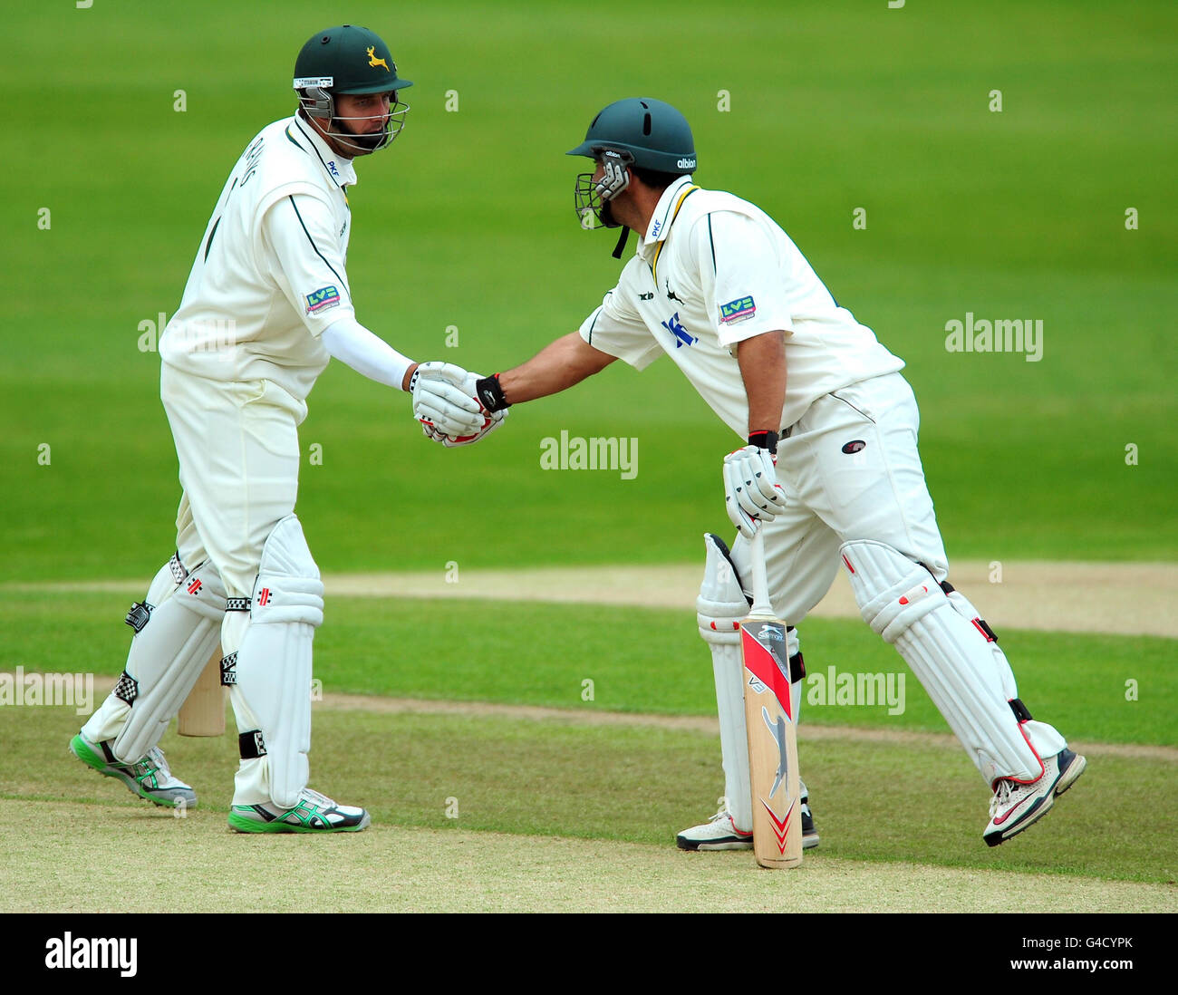 Nottinghamshire's Paul Franks (left) and Andre Adams celebrate a fifty ...