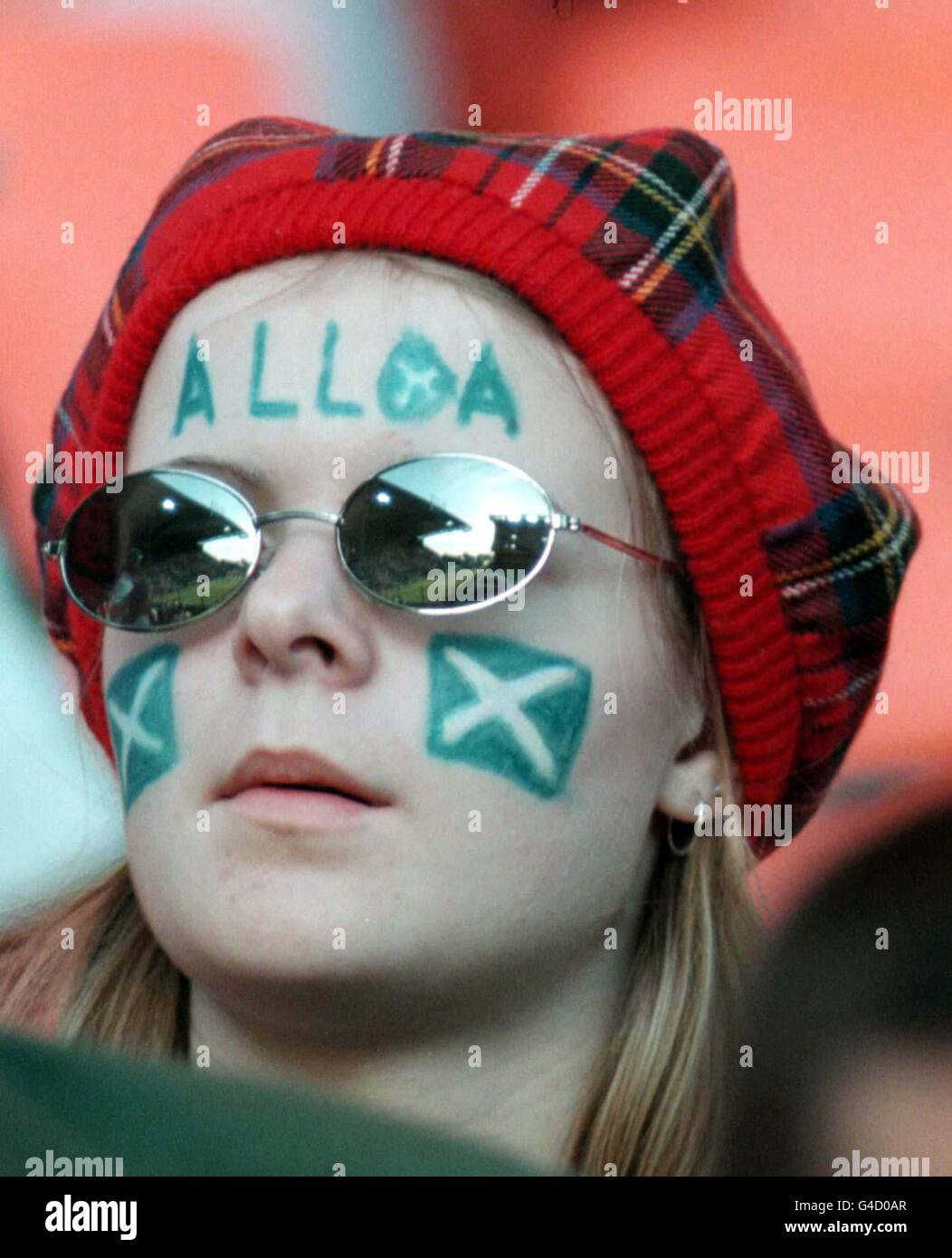 A Scottish fan looks dejected as she watches her team lose to Morocco ...