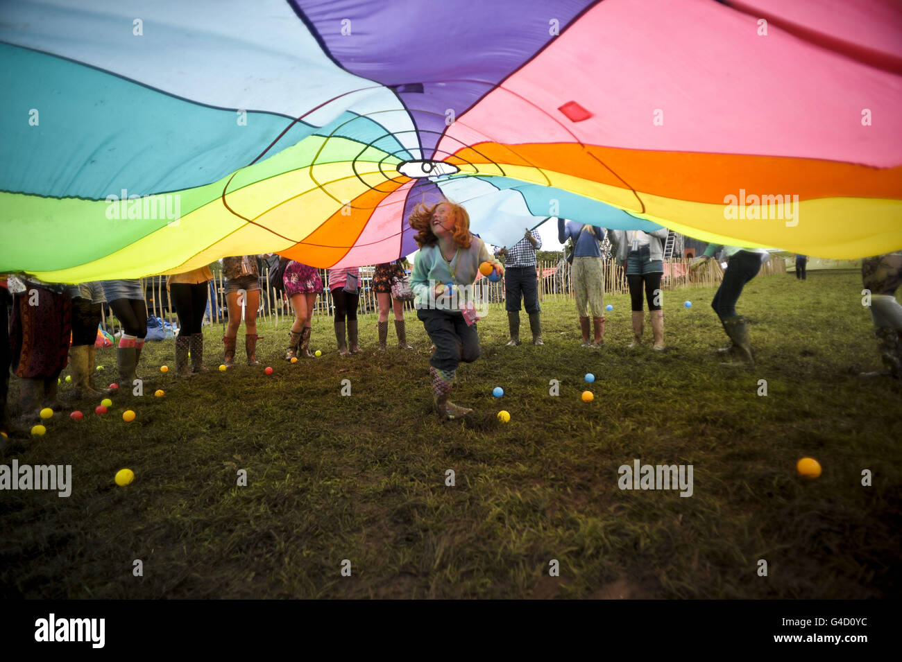 People play with a huge colourful sheet in the circus workshops in the ...