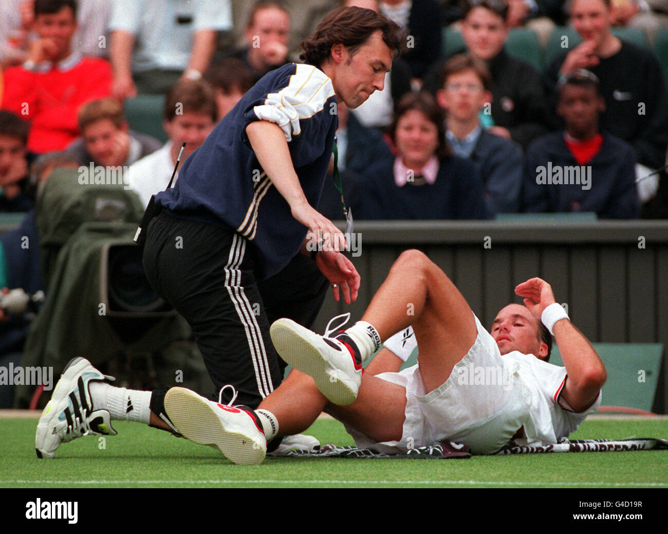 Patrick Rafter recieves some Physio treatment during the last set of ...