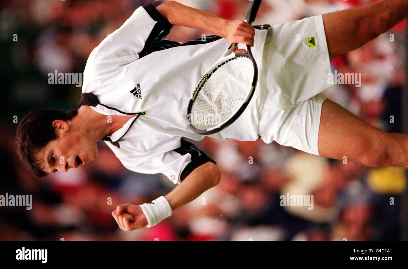 Tim Henman celebrates scoring a point in his match against Patrick ...
