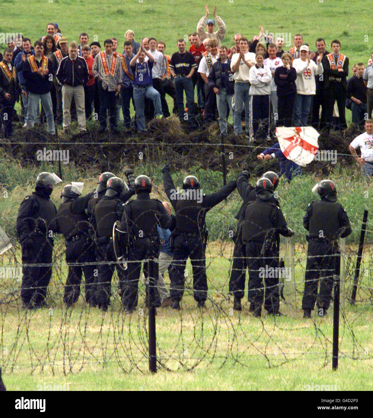 Two sides of the fence as Royal Ulster Constabulary Officers in riot ...