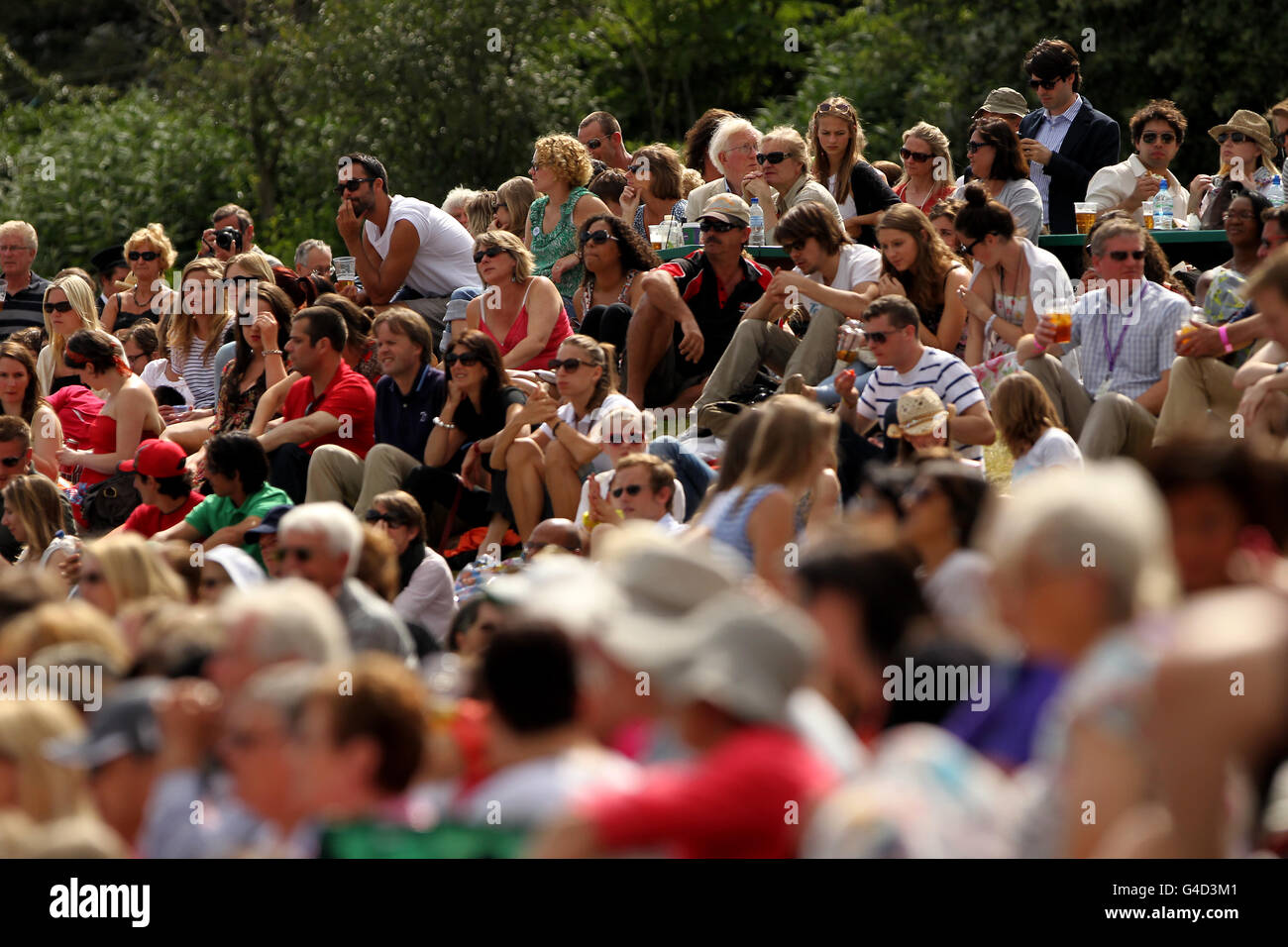 Spectators watch the action on a big screen from Murray Mount on day ...