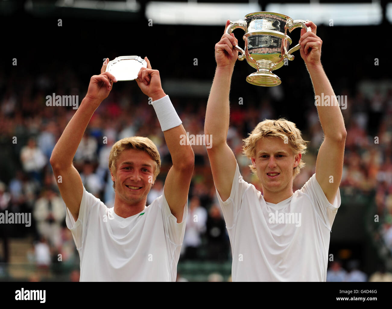 Australia's Luke Saville (right) celebrates with the trophy after ...