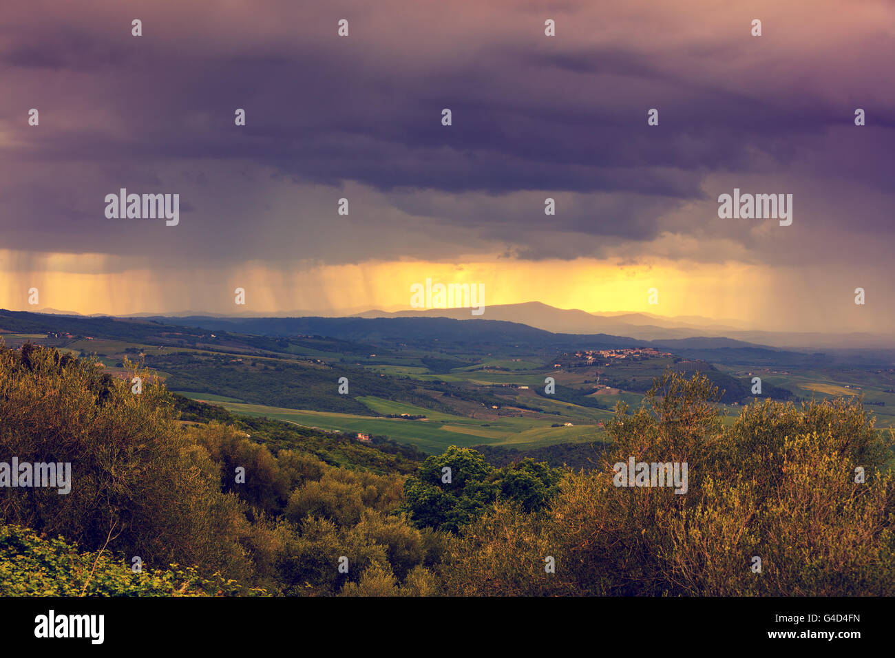 Tuscany valley in stormy weather at sunset, Italy Stock Photo - Alamy