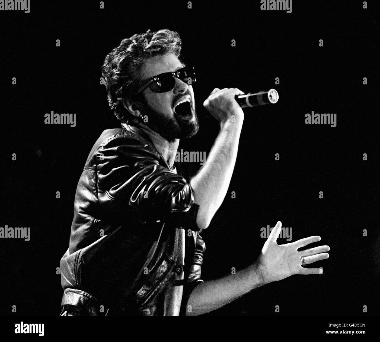 Singer George Michael on stage performing during the Live Aid Concert ...