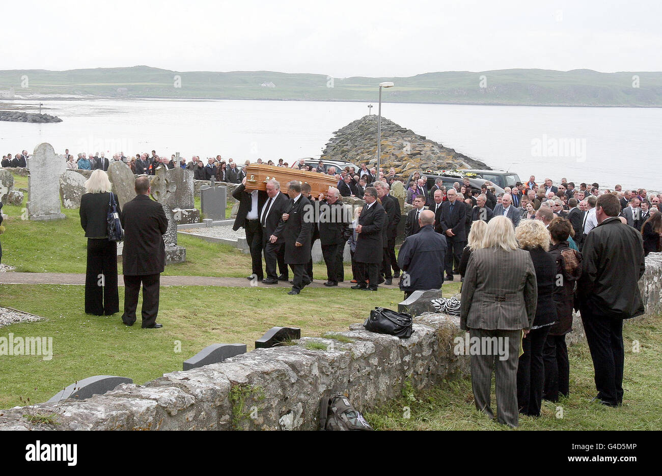 The coffin of Johnny Curry is carried into St Thomas' Church of Ireland ...