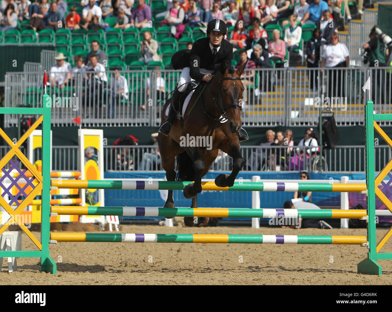 Great Britain's James Cooke riding Gambit competes in the Show Jumping ...
