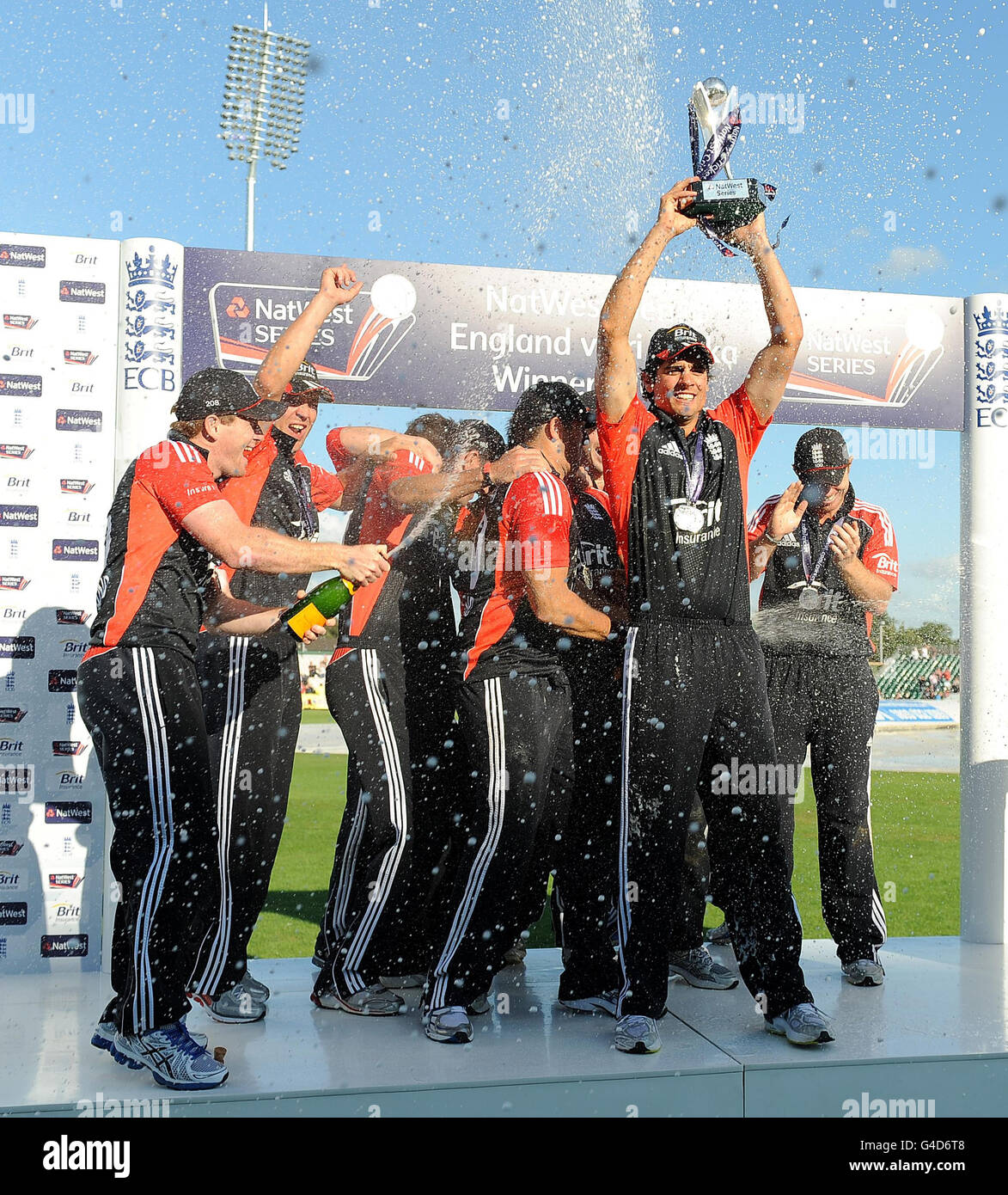 England's Alastair Cook (right) and team mates celebrate with the ...