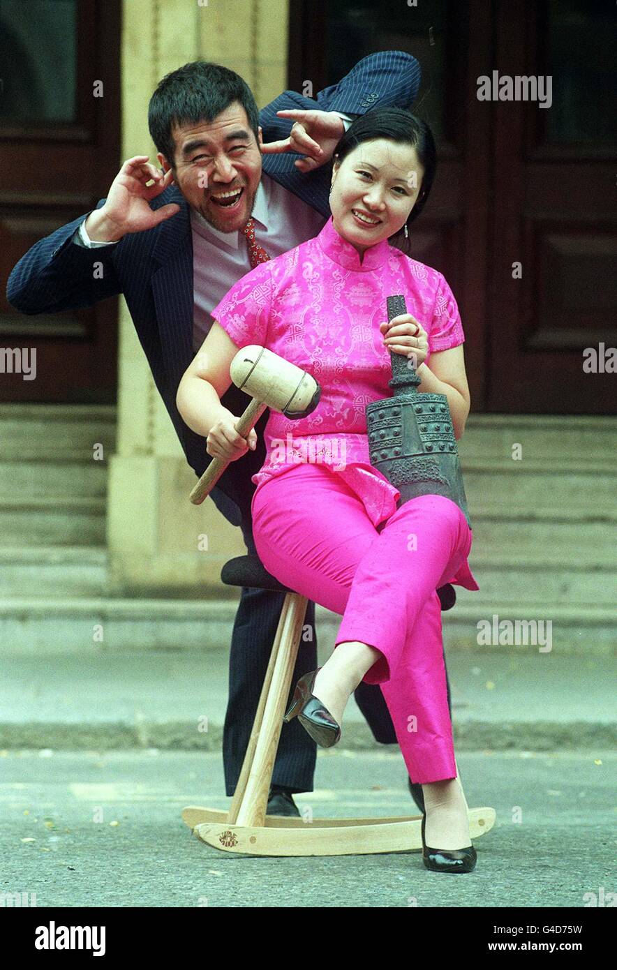 Two bellringers Mr Dong and Miss Lili from the Imperial Bell Ensemble ...