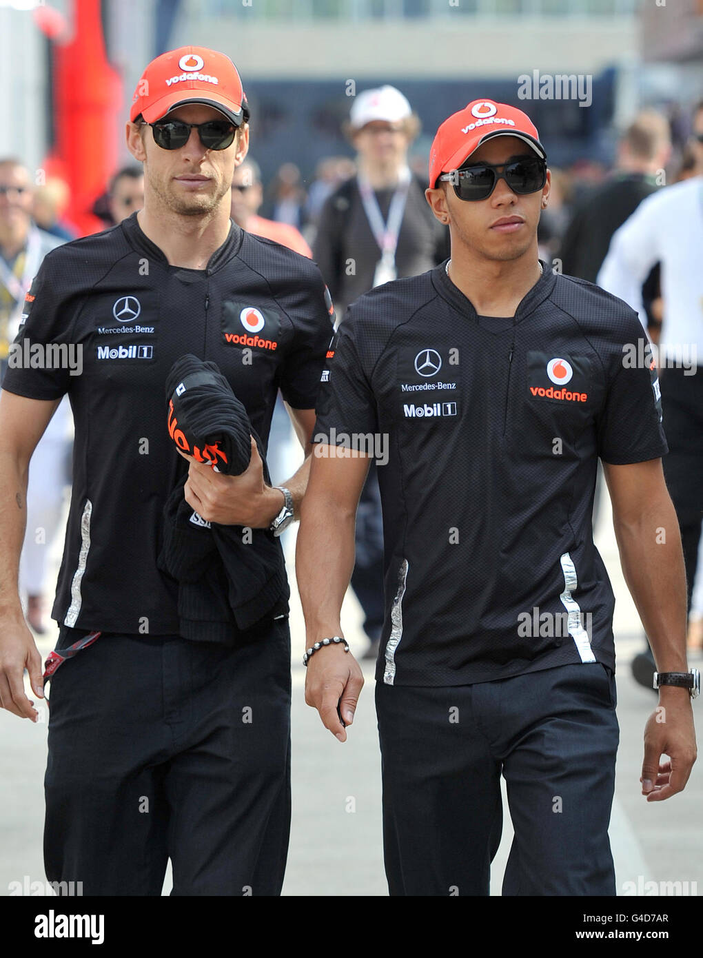 McLaren Mercedes' Lewis Hamilton and Jenson Button make their way down ...