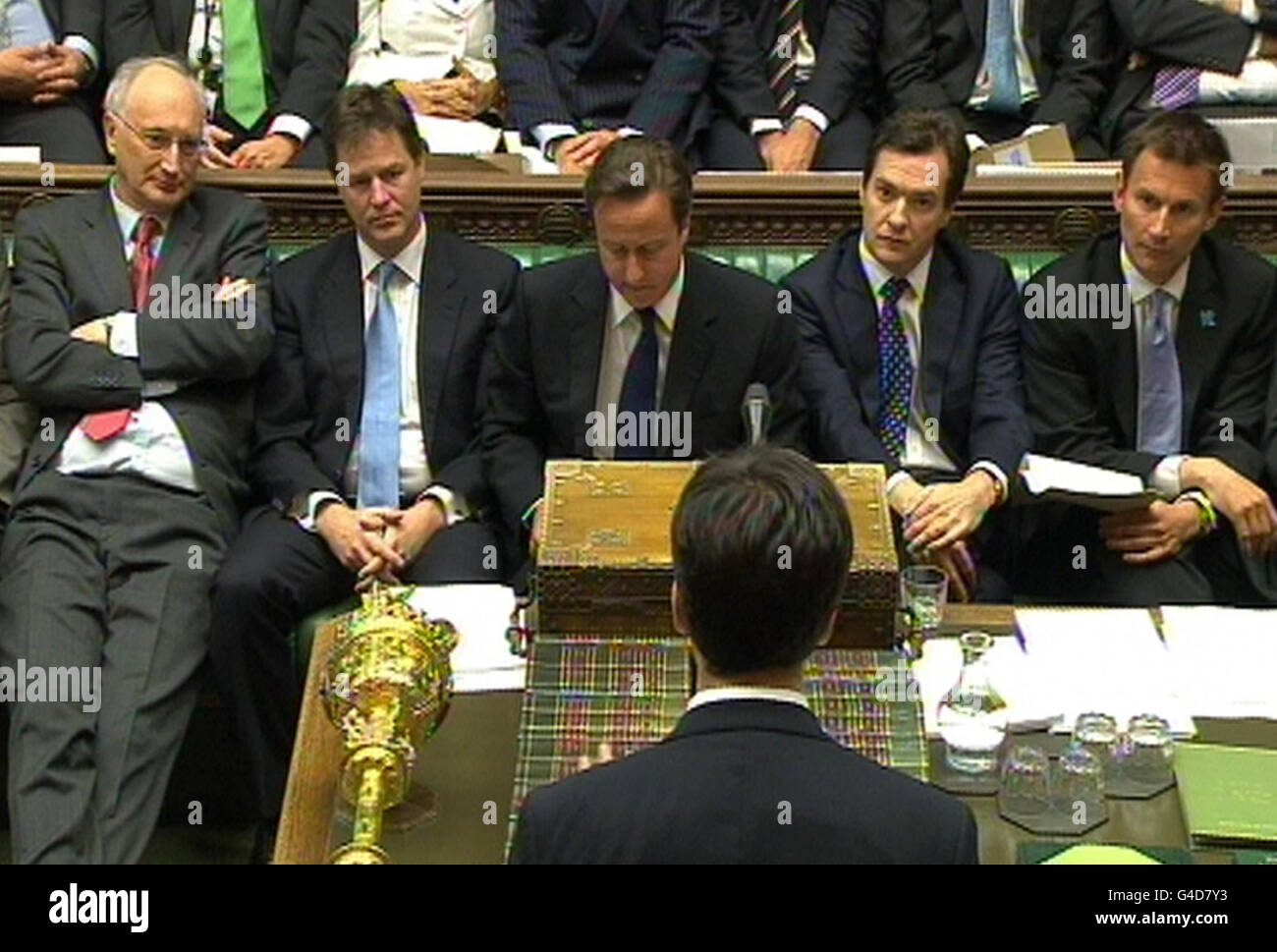 The coalition front bench listen as Labour Leader Ed Miliband speaks ...