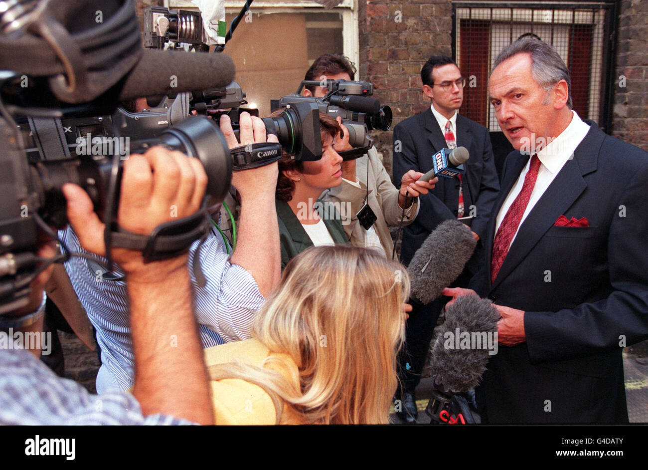 Cabinet Minister Jack Cunningham, talks to the media during his visit ...