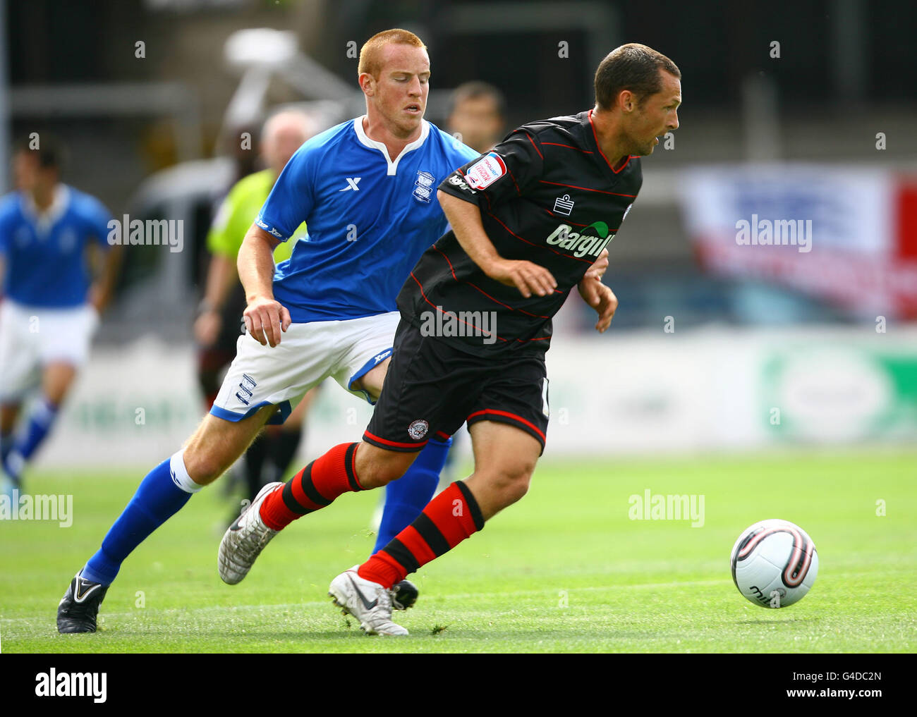 Hereford United's Kenny Lunt and Birmingham City's Adam Rooney (left ...