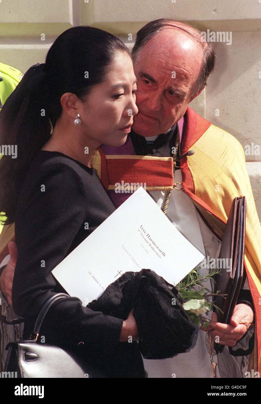 Canon Oates, rector of St Bride's Church, Fleet Street, talks with ...
