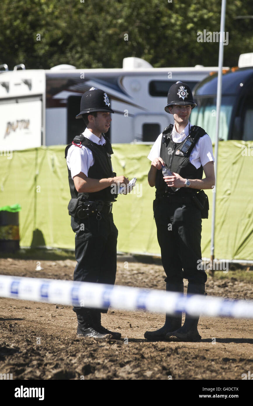 A police vehicle is parked behind a taped off area of Glastonbury ...