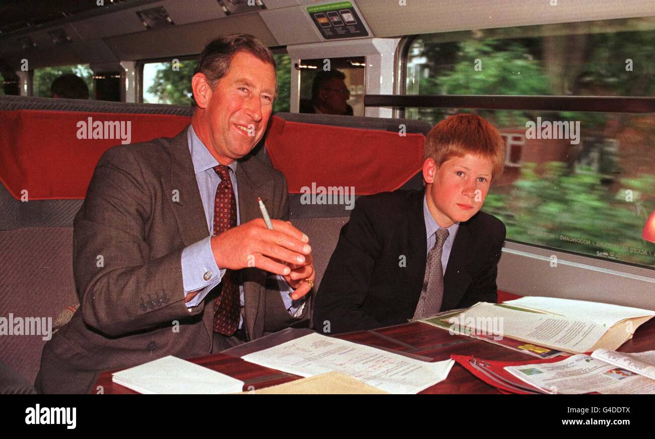 Prince Charles with his son Prince Harry, aboard the Eurostar train en ...