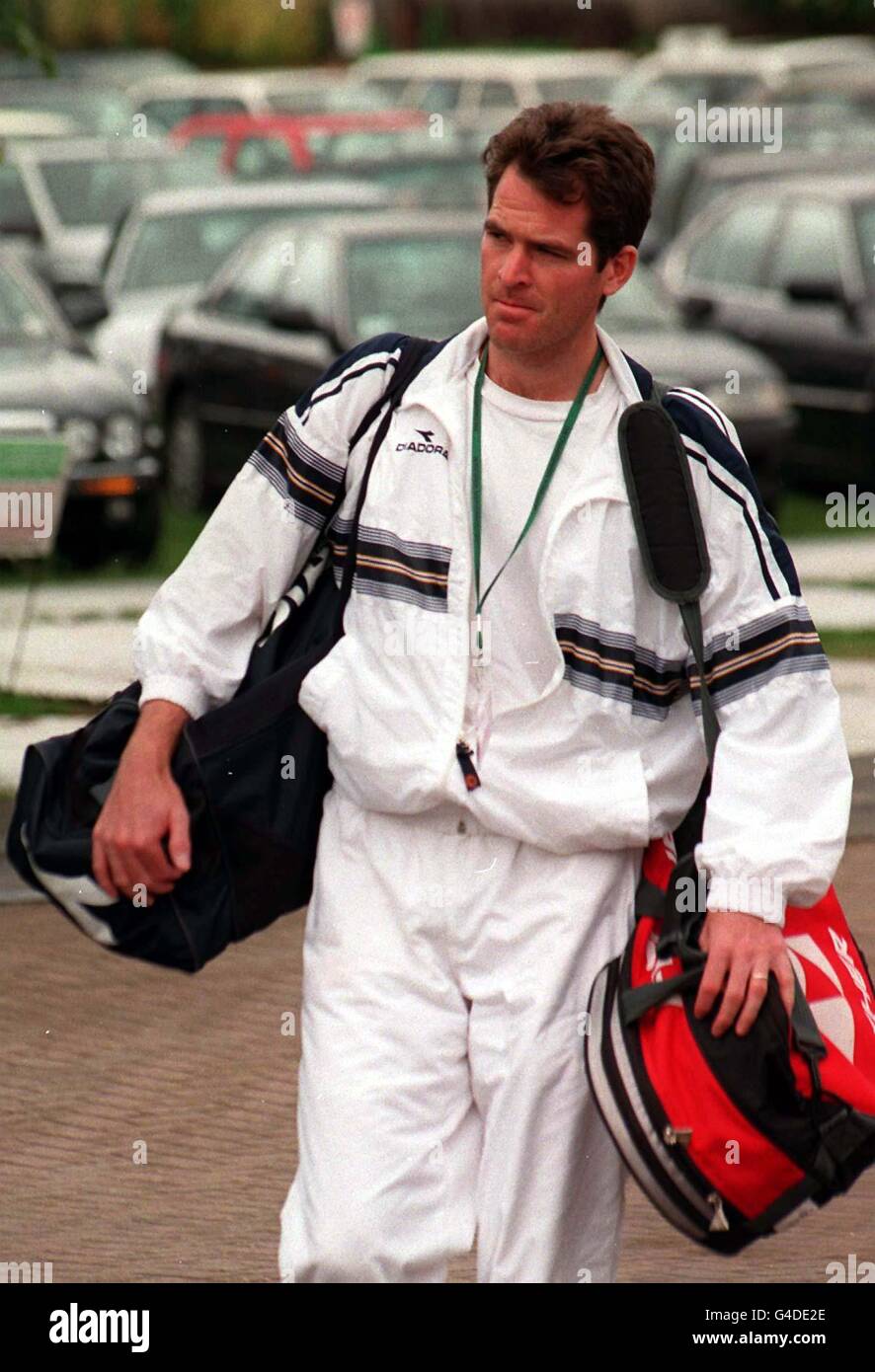 Britain's Chris Wilkinson returns to the Wimbledon complex after a ...