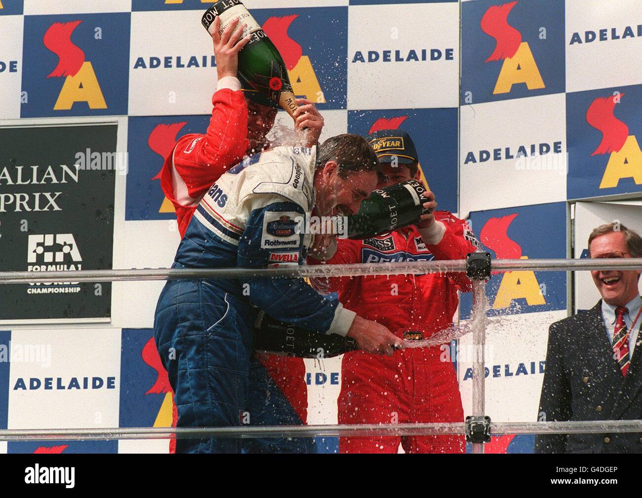 GERHARD BERGER AND MARTIN BRUNDLE POUR CHAMPAGNE OVER RACE WINNER NIGEL ...