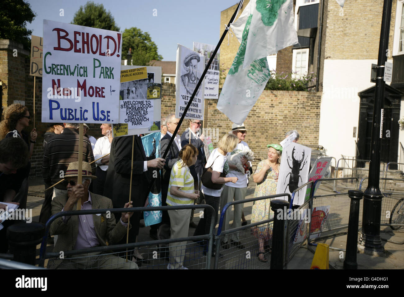 Protesters hold placards outside prior to the start of the Greenwich ...