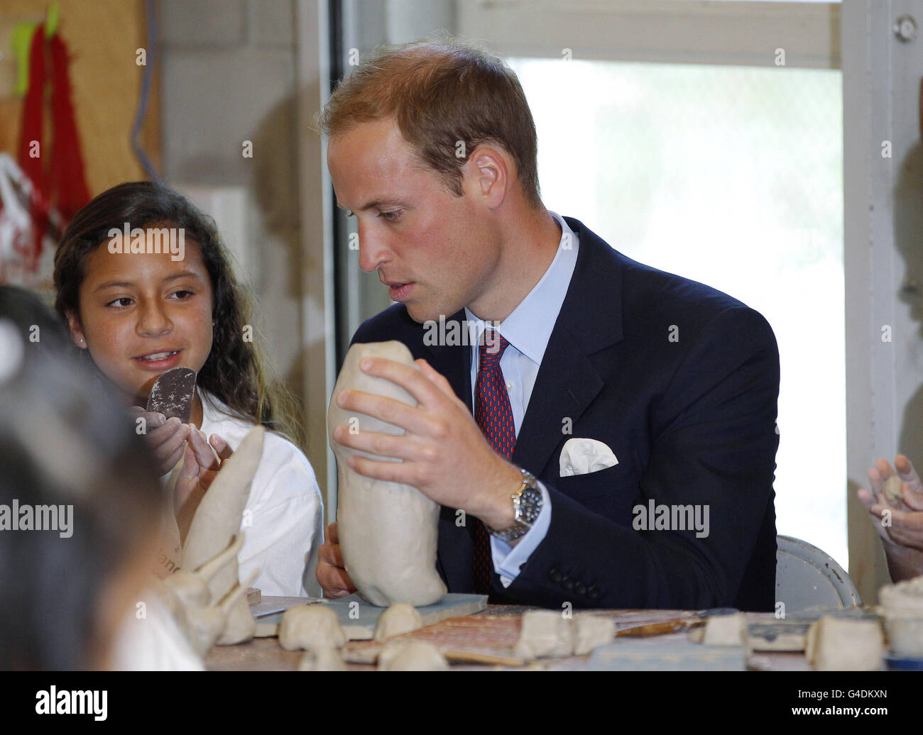 The Duke of Cambridge models a piece of clay during a visit to an inner ...
