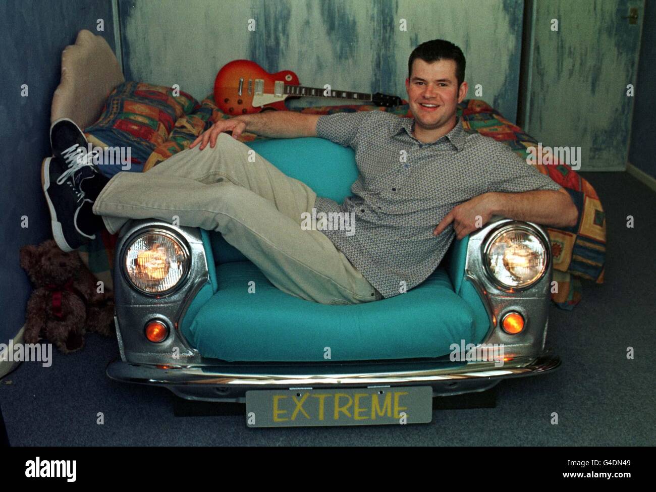 Mini-mad mechanic Trevor Hatton relaxes in his favourite armchair ...