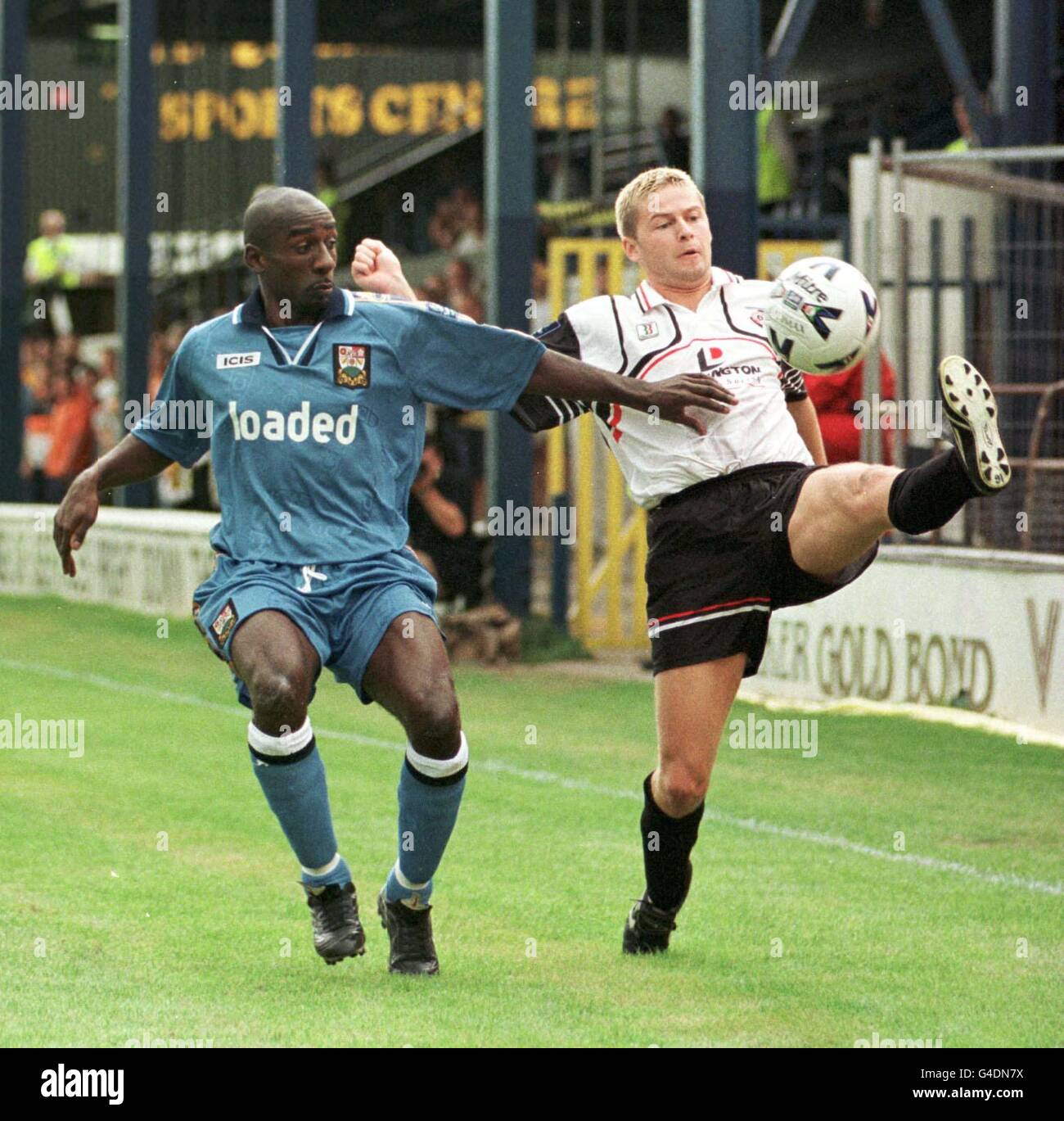 Barnets Phil Simpson (left) challenges Darlingtons Glen Naylor. Photo ...