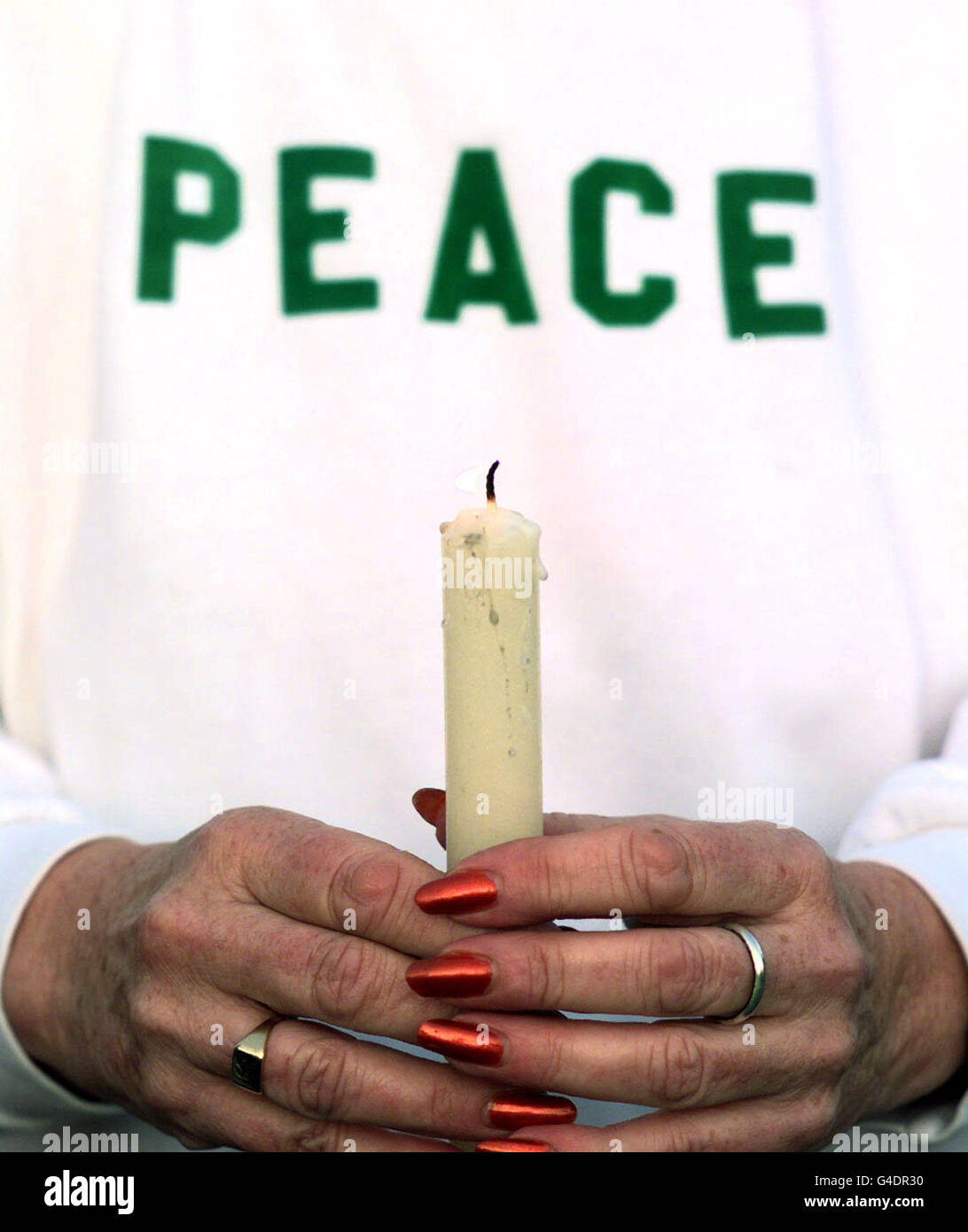 Woman holds candle during vigil hi-res stock photography and images - Alamy