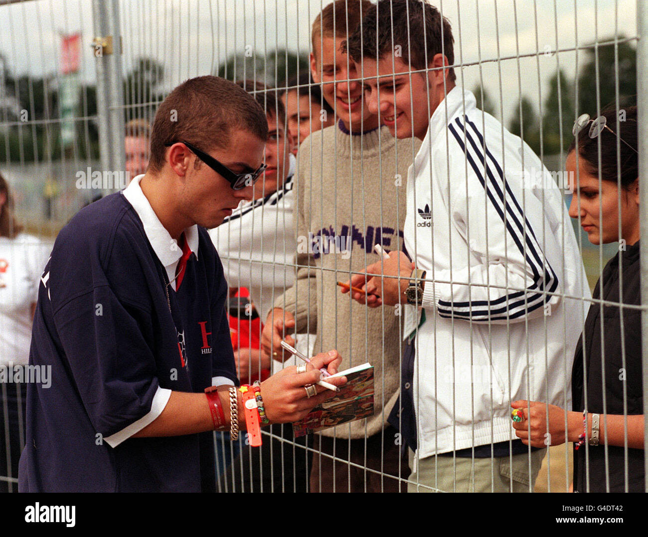 ACTOR PAUL DANAN FROM "HOLLYOAKS" SIGNS AUTOGRAPHS FOR FANS DURING A ...