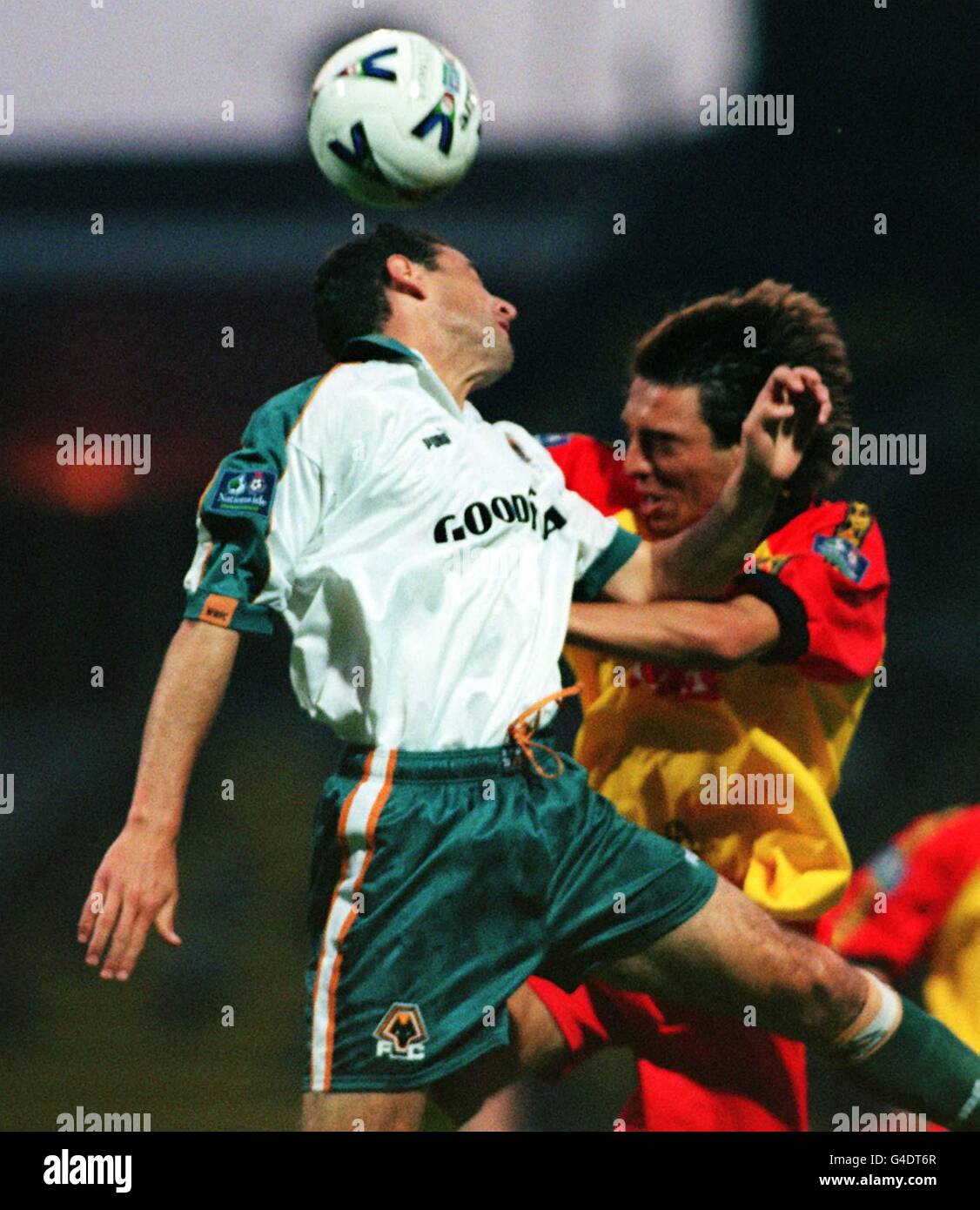 Wolverhampton Wanderers Kevin Muscat (left) rises above Watford's Clint ...