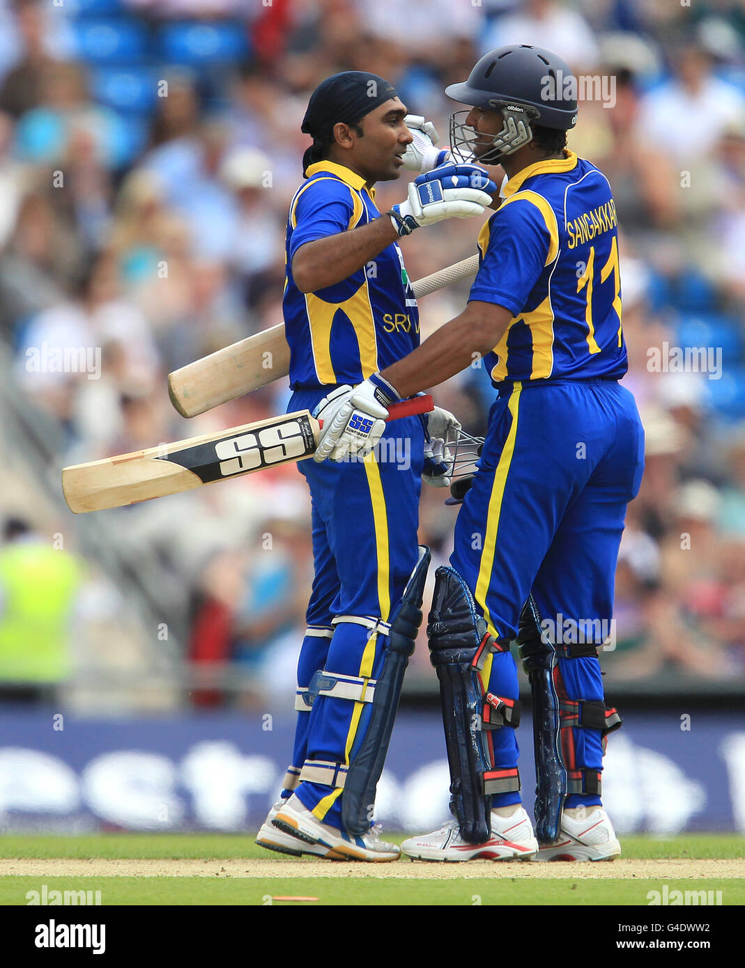 Sri Lanka's Mahele Jayawardene embraces Kumar Sangakkara after hitting ...
