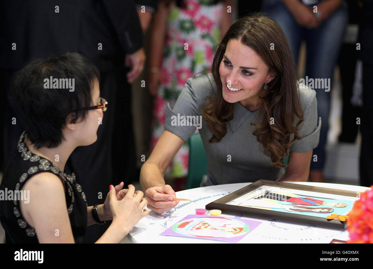 Catherine, Duchess of Cambridge talks to a young girl in a children's ...