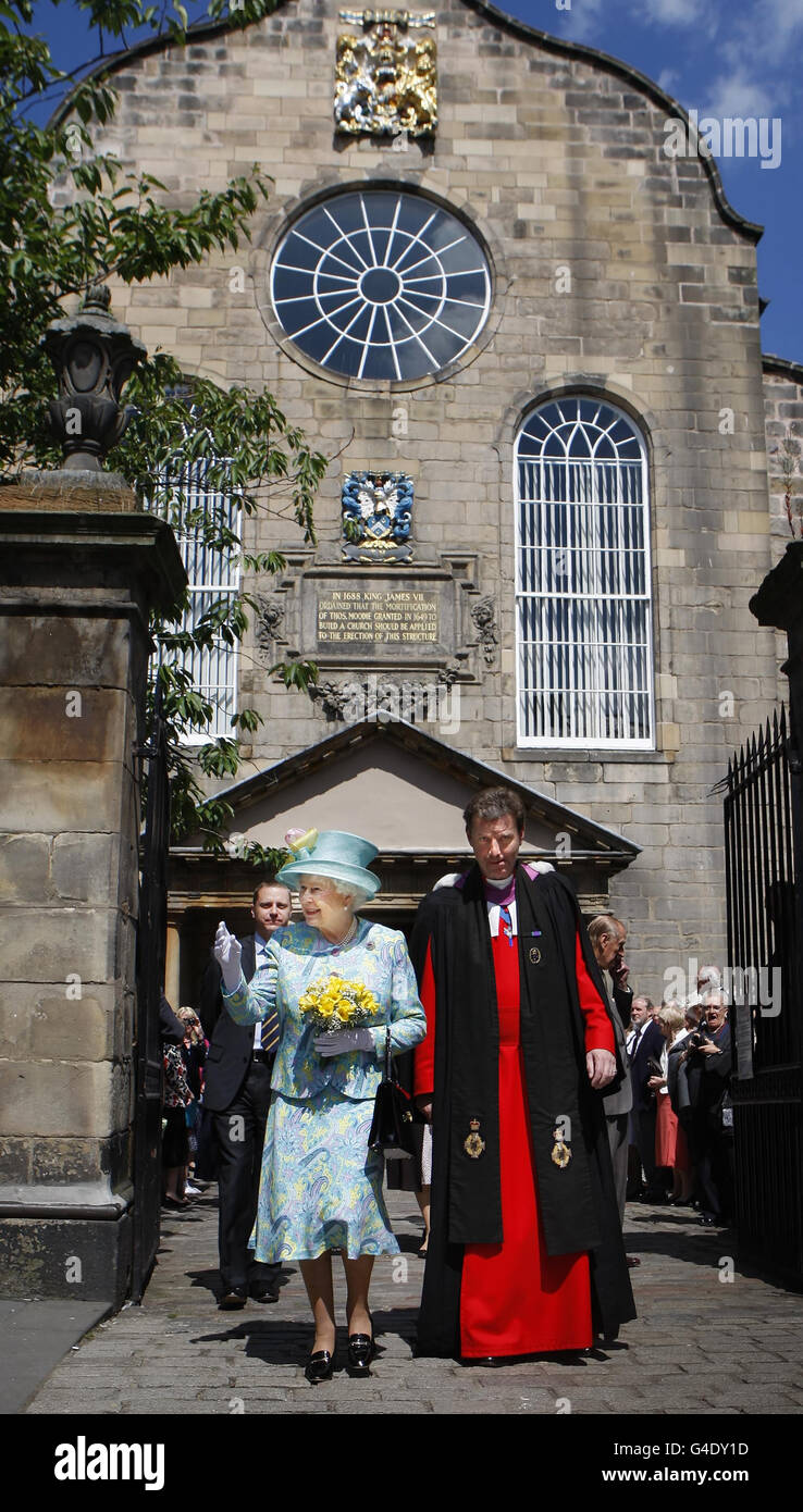 Queen Elizabeth II, accompanied by the Reverend Neil Gardner following ...