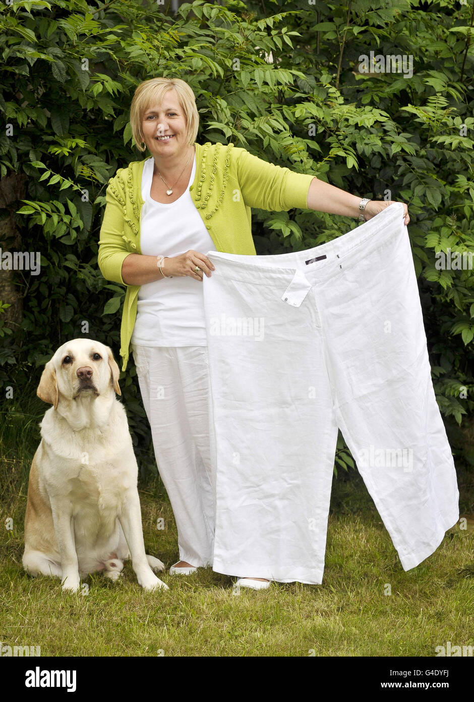 Formerly morbidly obese Labrador, Lucky, 5, with his owner and fellow ...