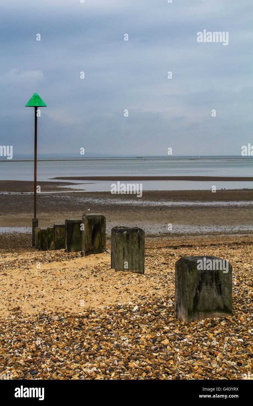 Wooden posts shore sky sunset beach hi-res stock photography and images ...