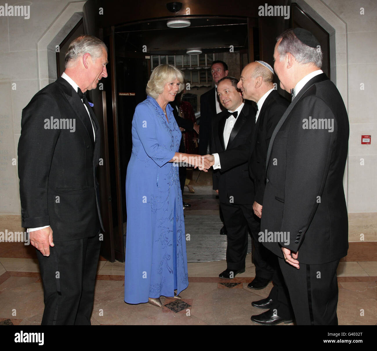 The Prince of Wales and The Duchess of Cornwall greet members of the ...