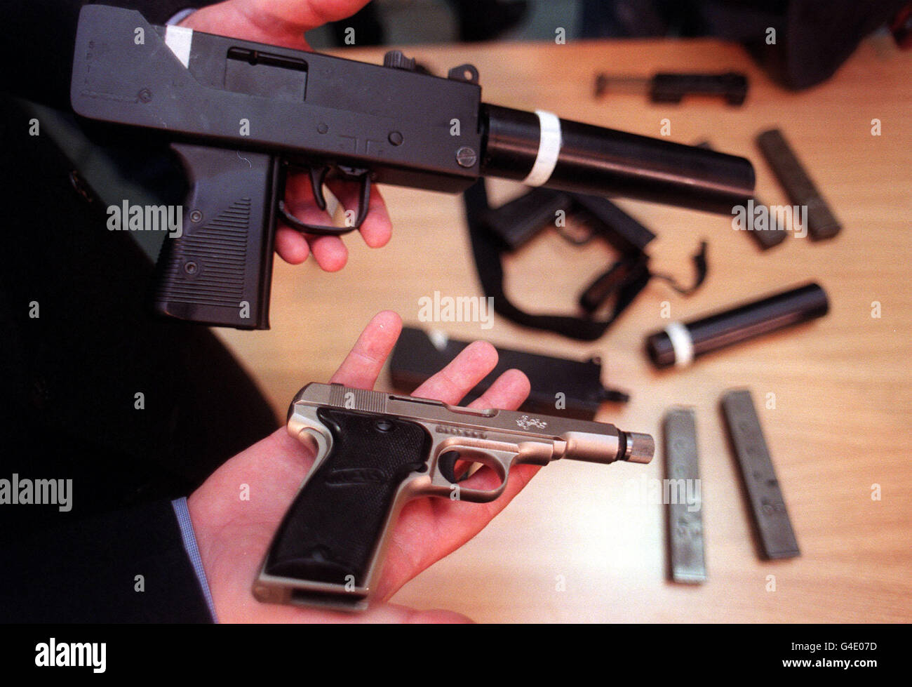 A London police detective holds a MAC 10 Ingram machine pistol with ...