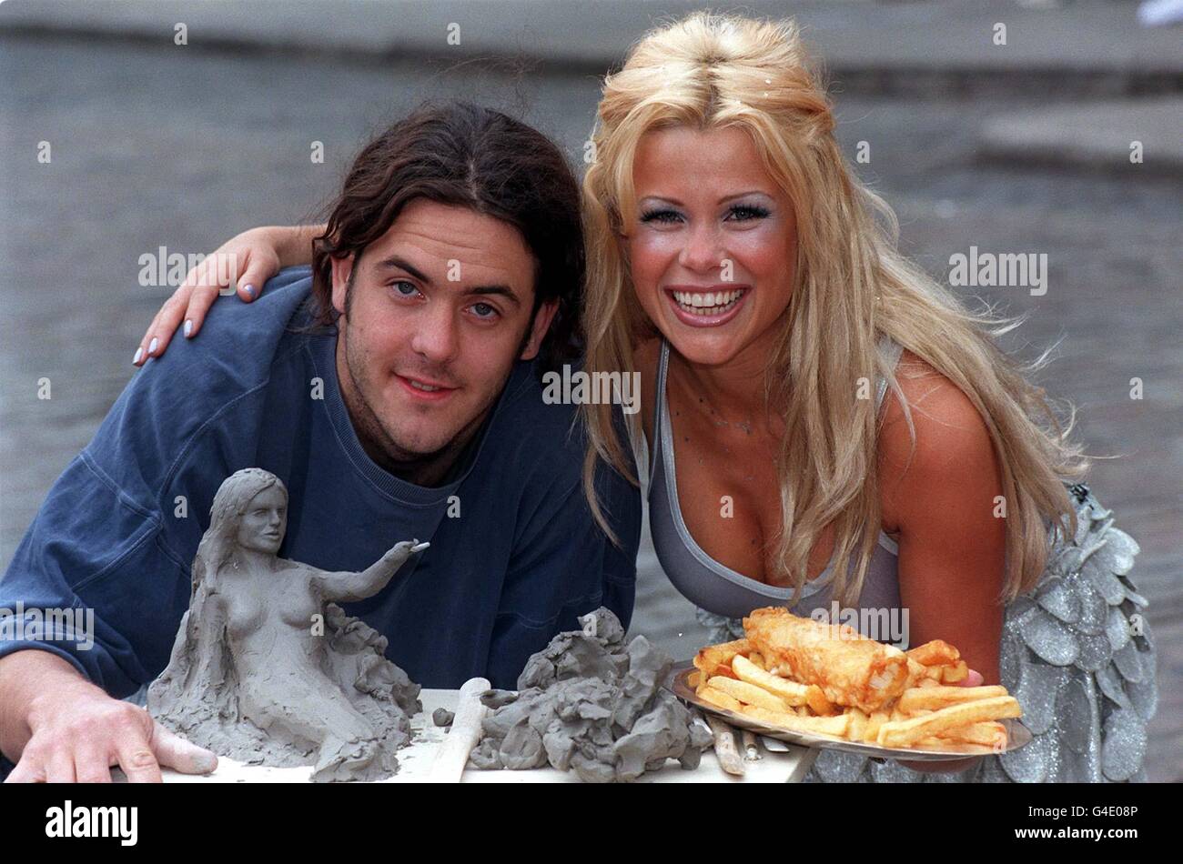 Model Melinda Messenger poses as a mermaid eating fish and chips with ...