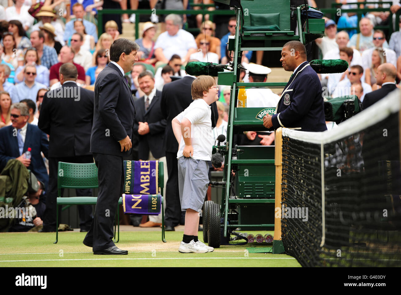 George Griffith, 12, before making the coin toss for the men's singles ...