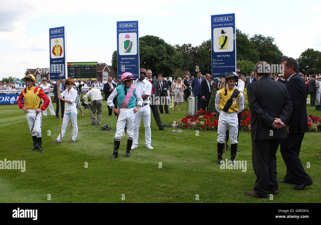 Jockeys Johnny Murtagh (left), Ryan Moore (centre) and Neil Callan wait ...